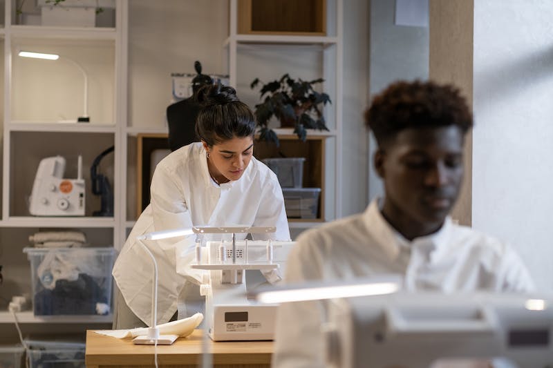 man and woman working in a tailor shop – Quilting at the Beach